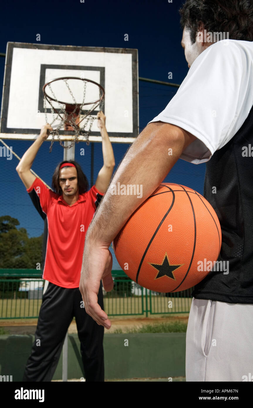 Two young men playing basketball Stock Photo - Alamy