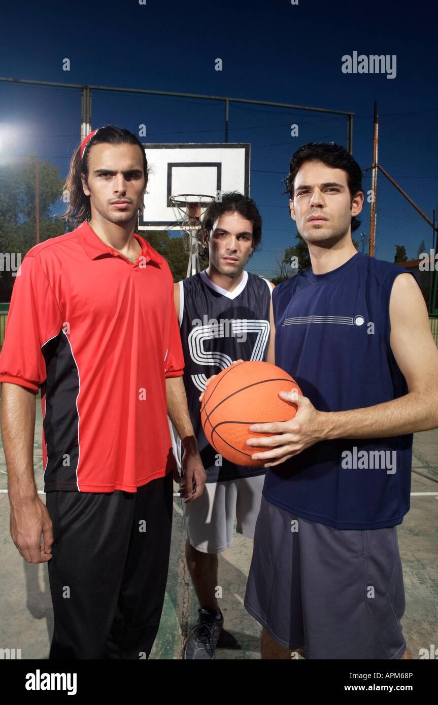 Three basketball players Stock Photo - Alamy