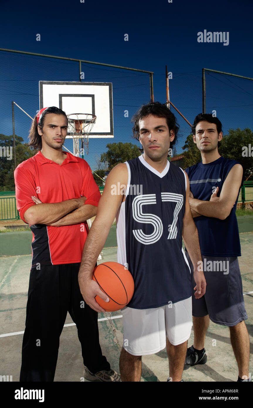 Three basketball players Stock Photo - Alamy