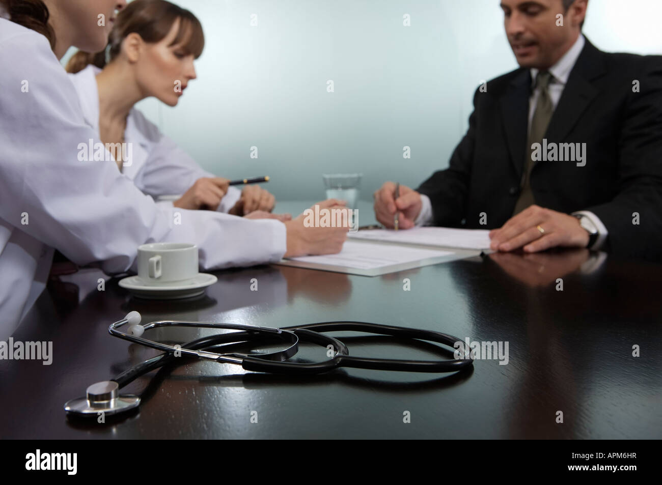 Hospital managers board meeting Stock Photo - Alamy