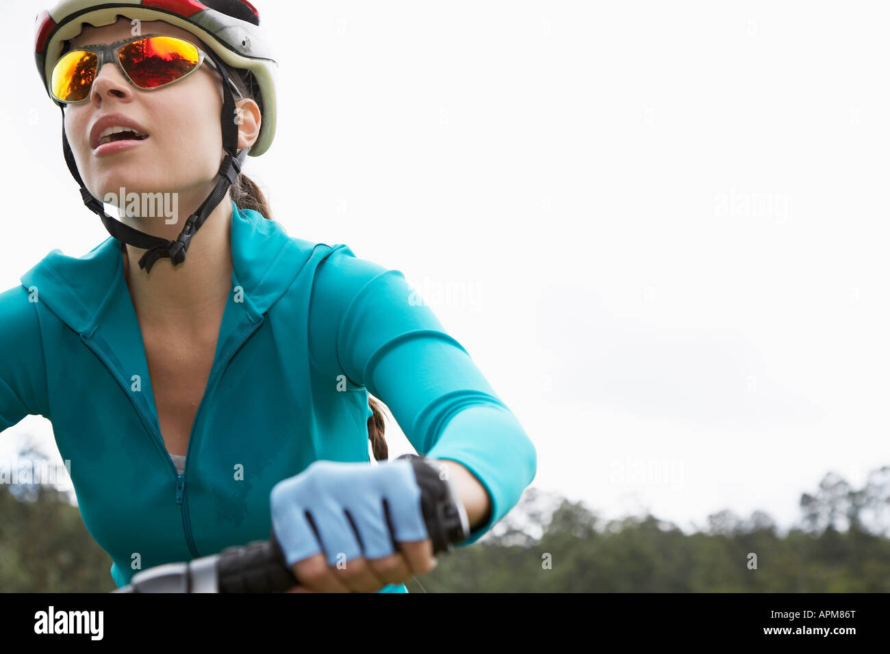 Young woman cycling, close-up Stock Photo - Alamy