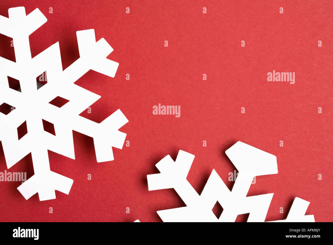 Paper snowflakes on red background (close-up Stock Photo - Alamy