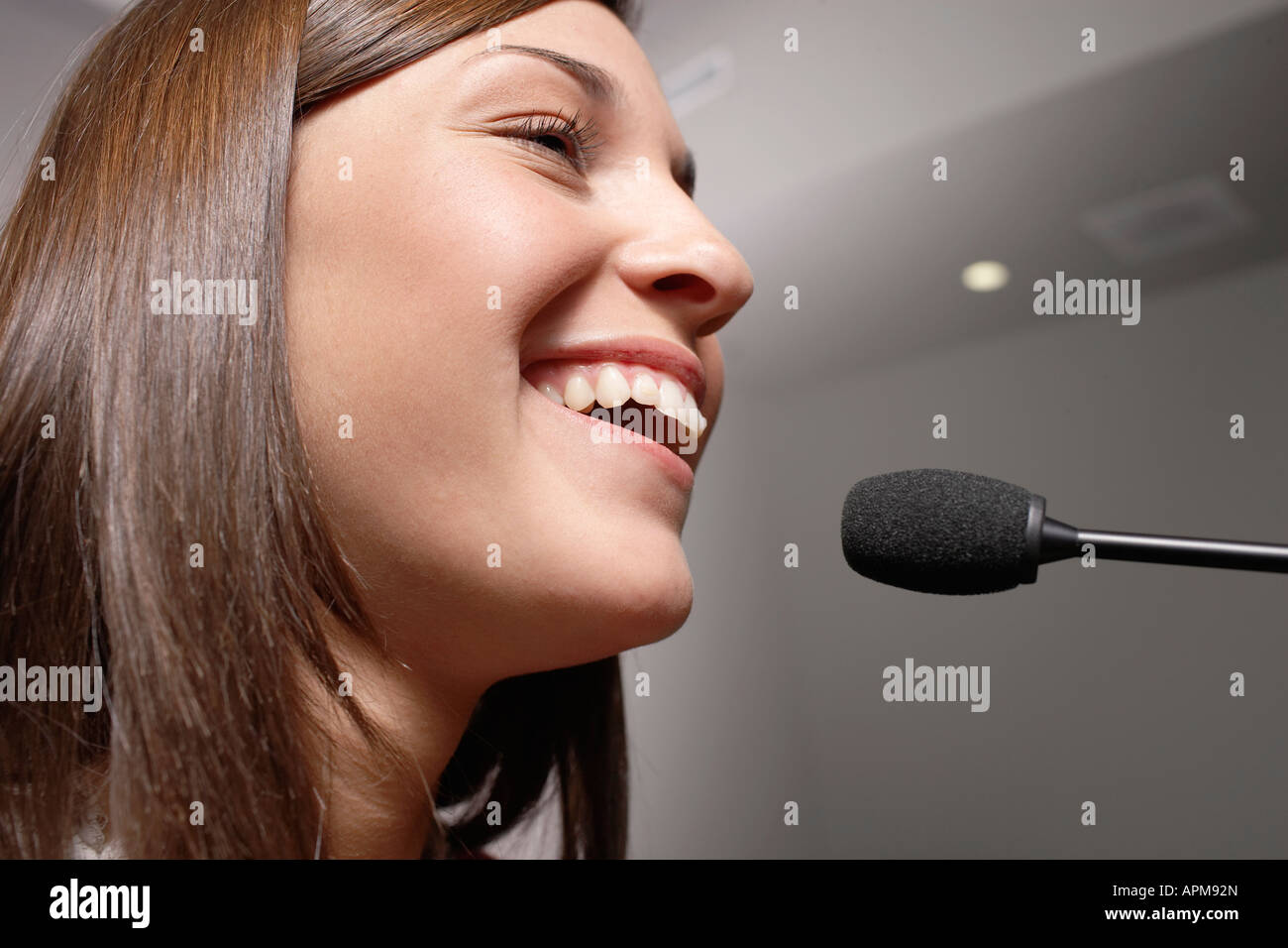 Student talking to microphone (close-up Stock Photo - Alamy