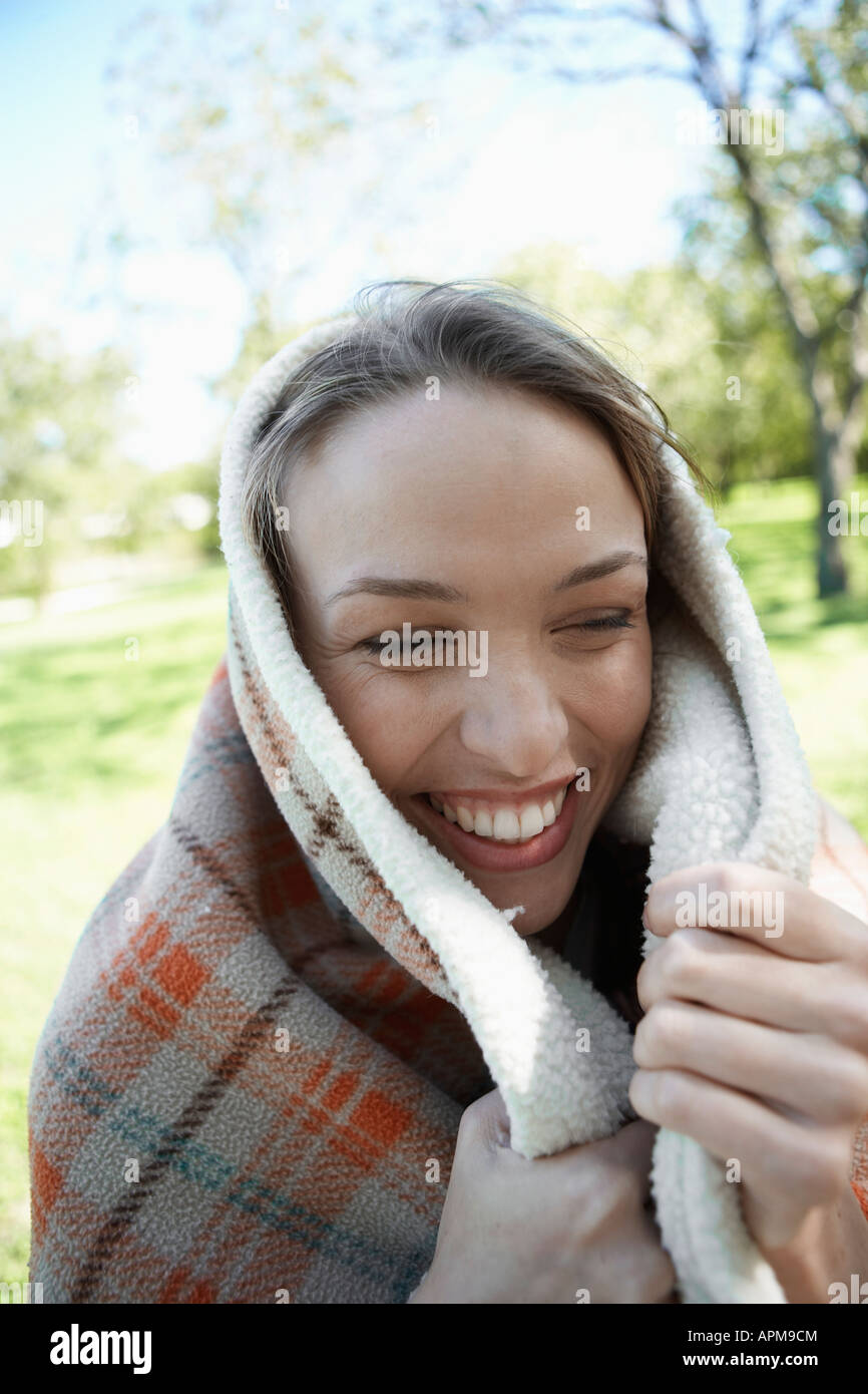 Young woman wrapped in a blanket Stock Photo - Alamy