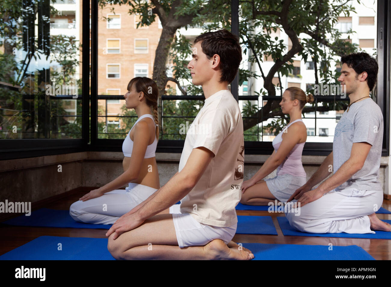 Teaching Yoga, classroom Stock Photo - Alamy
