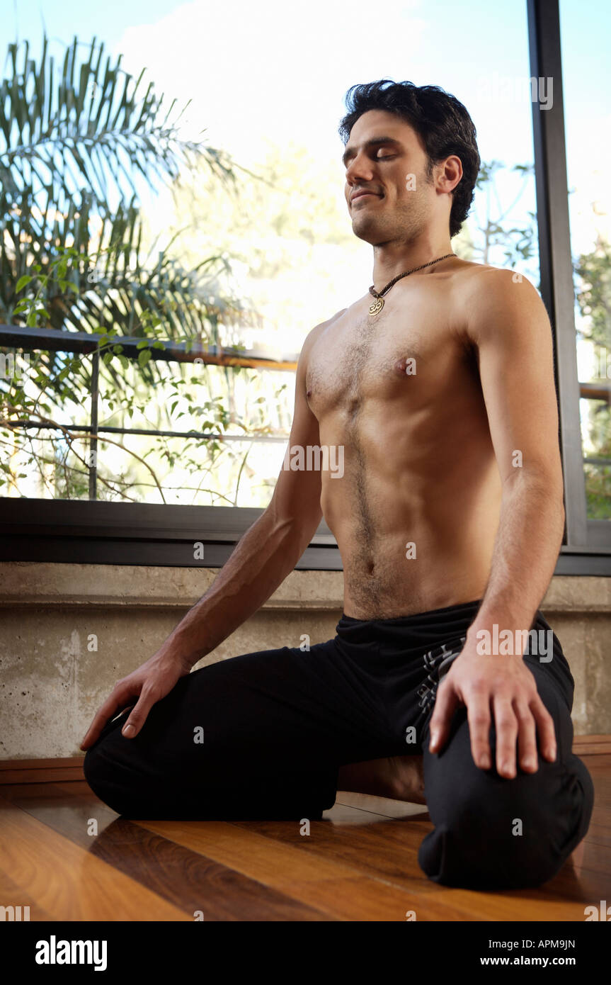 Man practicing yoga Stock Photo - Alamy