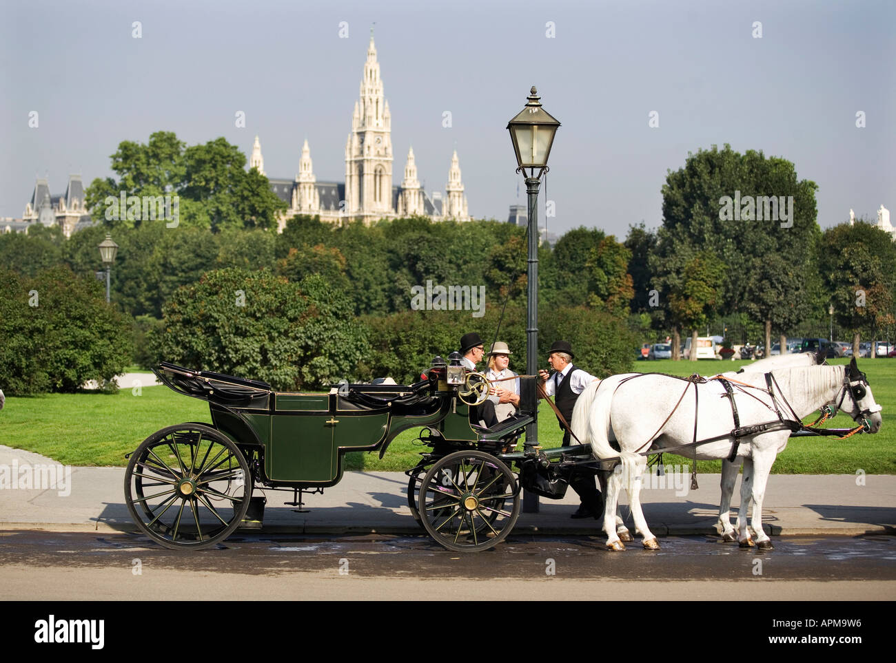 Austria, Vienna, horse cart with town hall in background Stock Photo ...