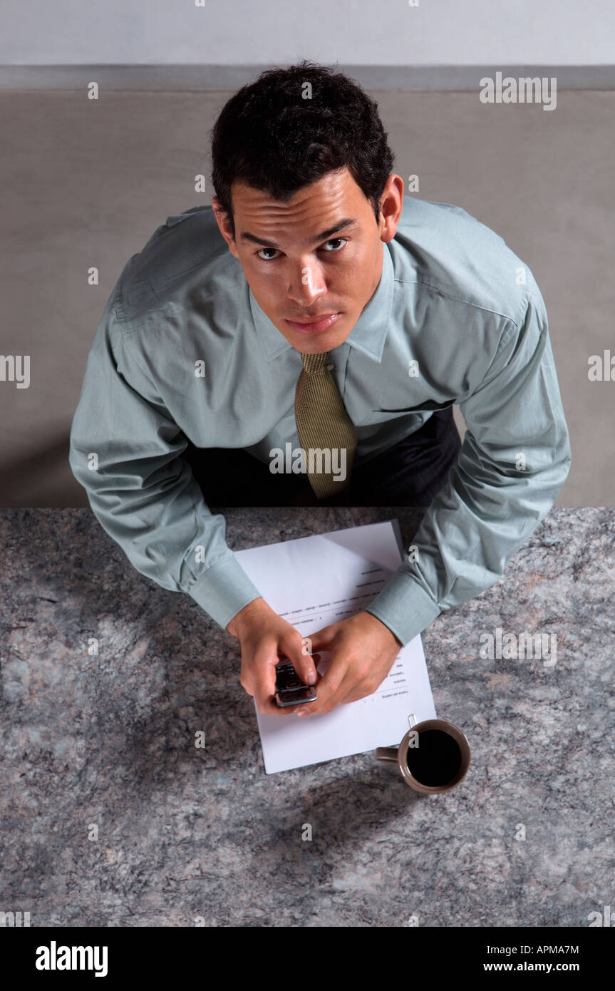 Business man reading paperwork Stock Photo - Alamy