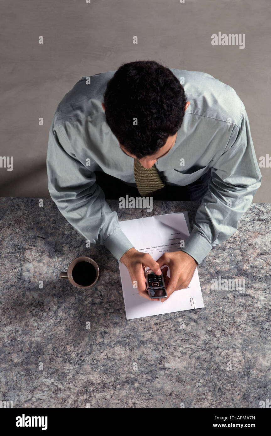 Business man reading paperwork Stock Photo - Alamy