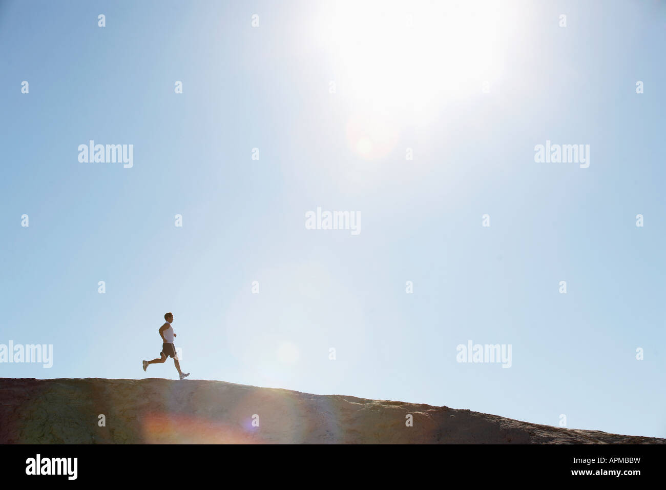 Sun over runner Stock Photo - Alamy