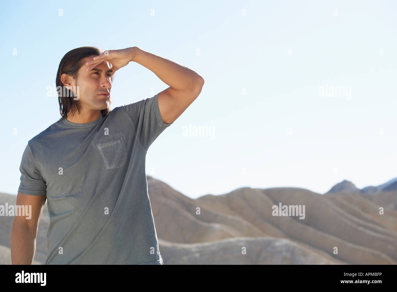 Man looking at view in desert Stock Photo - Alamy