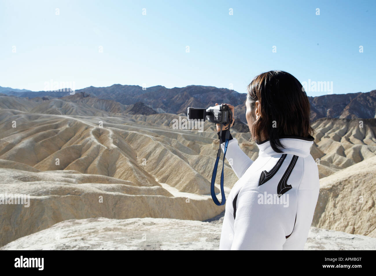 Man using video camera in desert, Death Valley, California, USA Stock ...