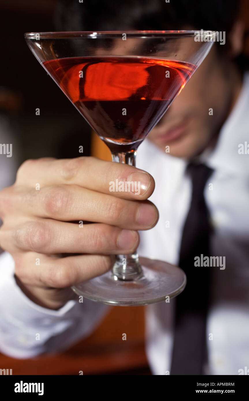 Drink shown to camera in a bar Stock Photo - Alamy
