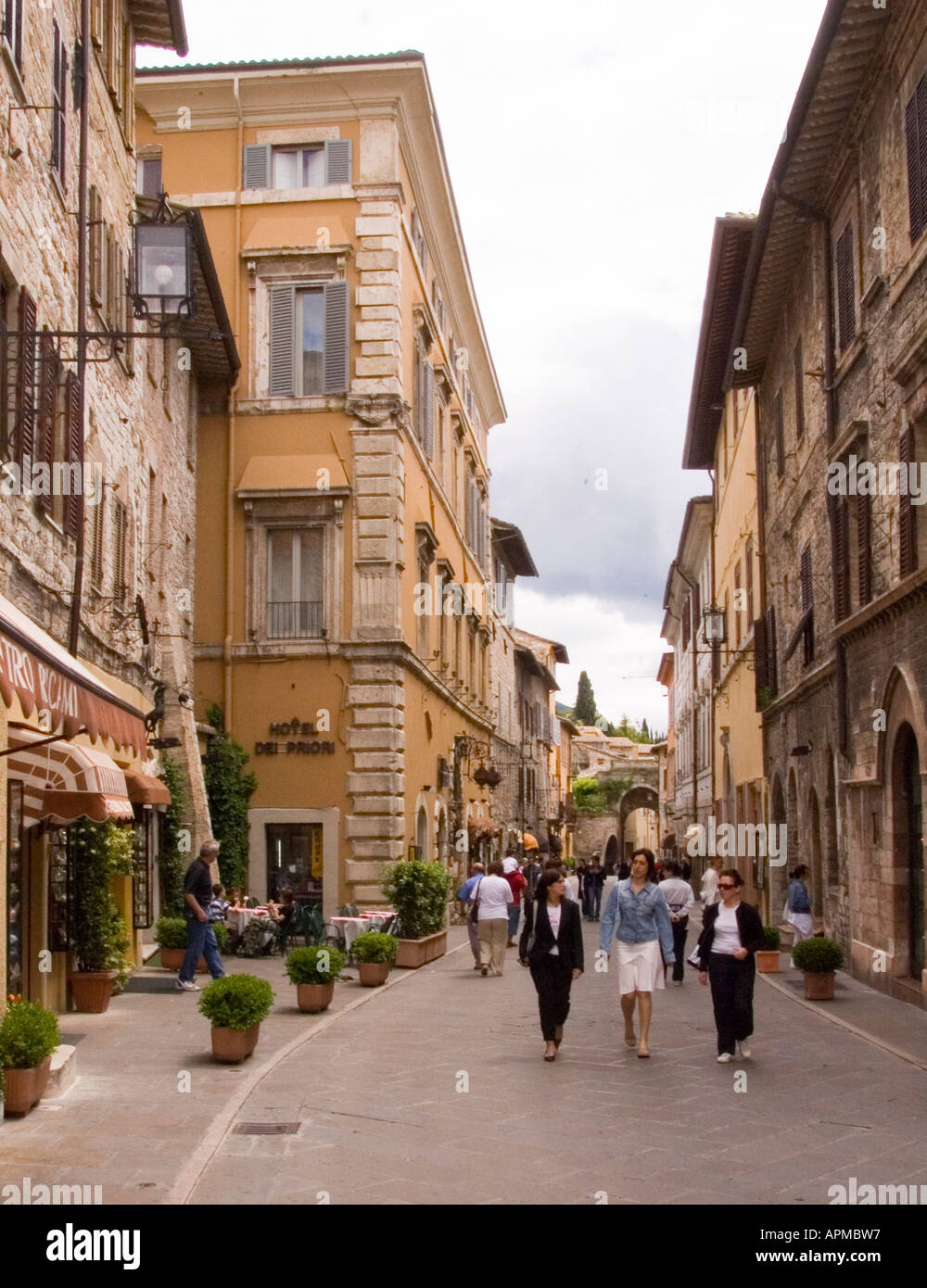 Tourist strolling the narrow streets of Assisi Italy Stock Photo - Alamy