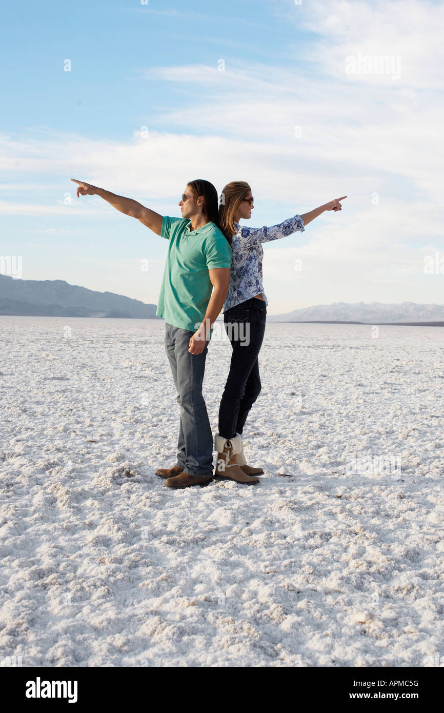 Standing in opposite directions hi-res stock photography and images - Alamy
