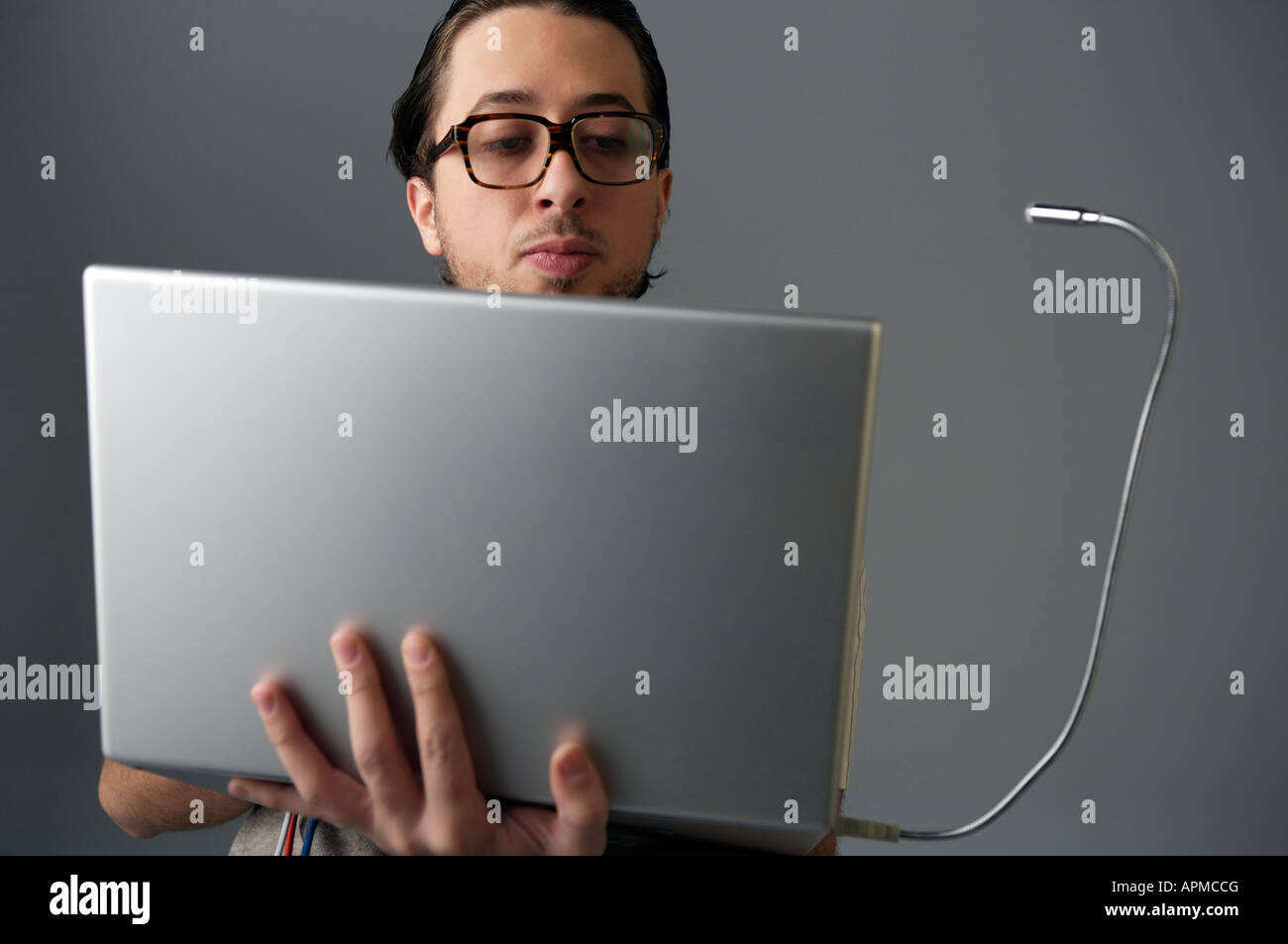 Nerd man with laptop Stock Photo - Alamy