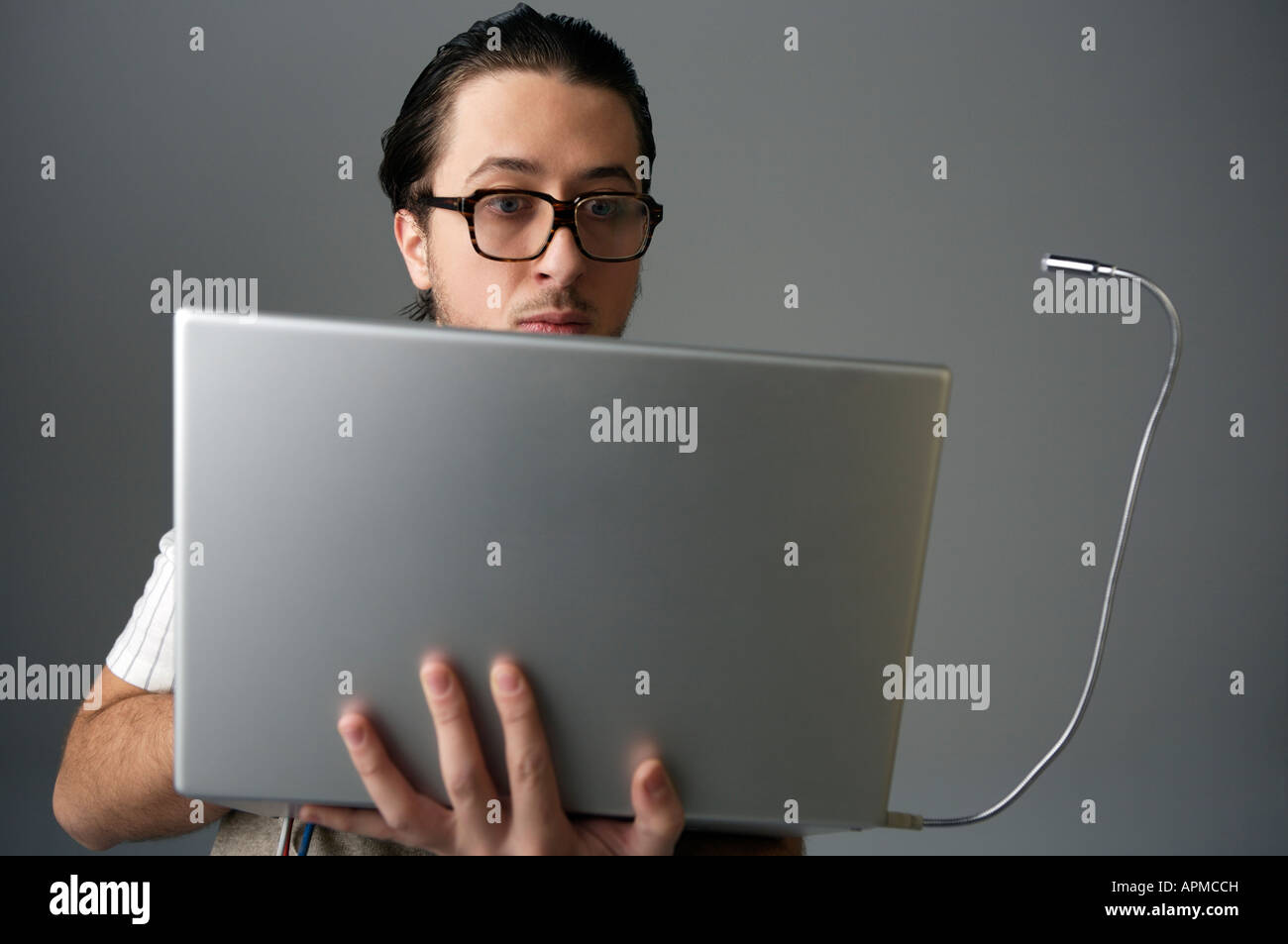 Nerd man with laptop Stock Photo - Alamy