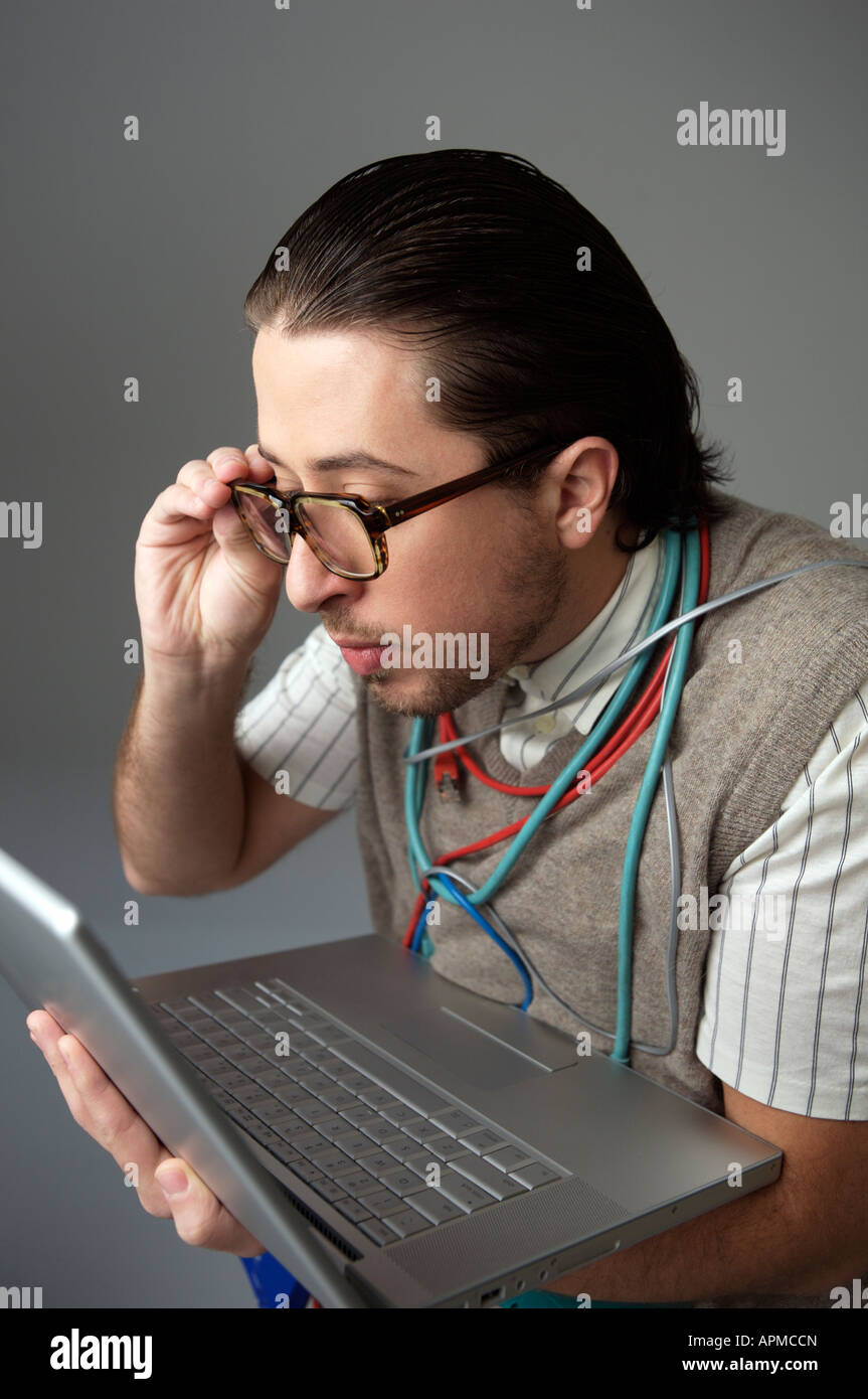 Nerd man with laptop Stock Photo - Alamy