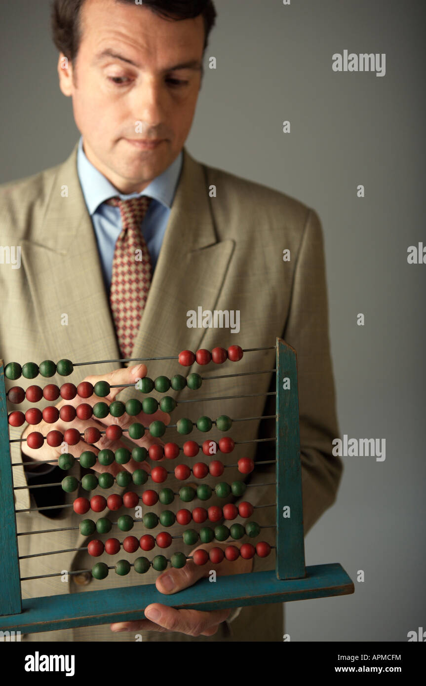 Man holding an Abacus Stock Photo - Alamy