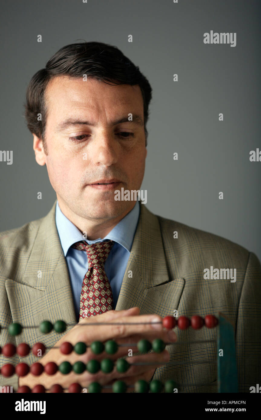 Man holding an Abacus Stock Photo - Alamy