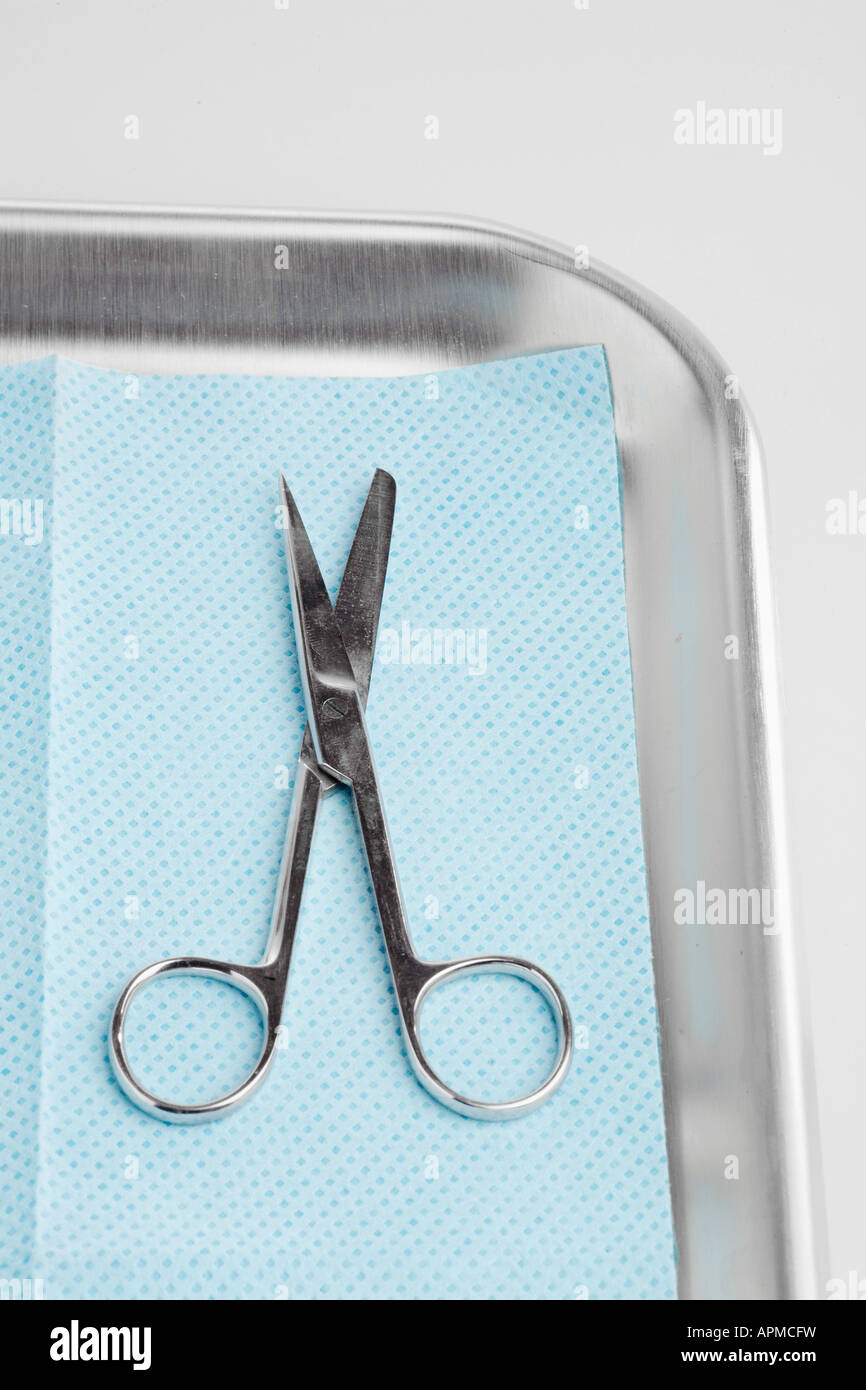 Medical scissors on tray Stock Photo - Alamy