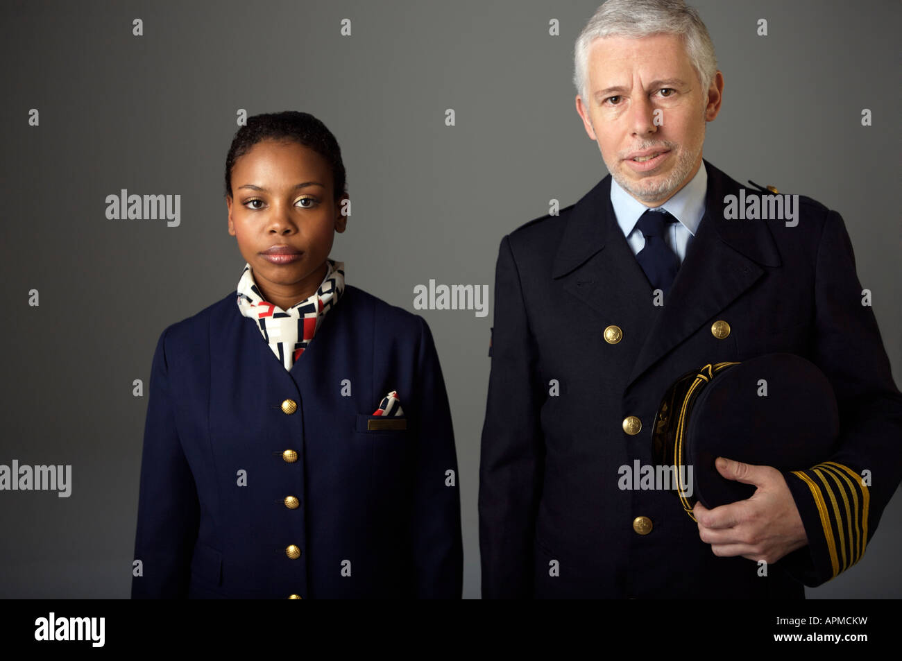 Pilot and stewardess Stock Photo - Alamy