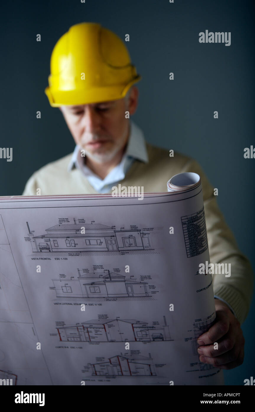 Architect looking plan Stock Photo - Alamy