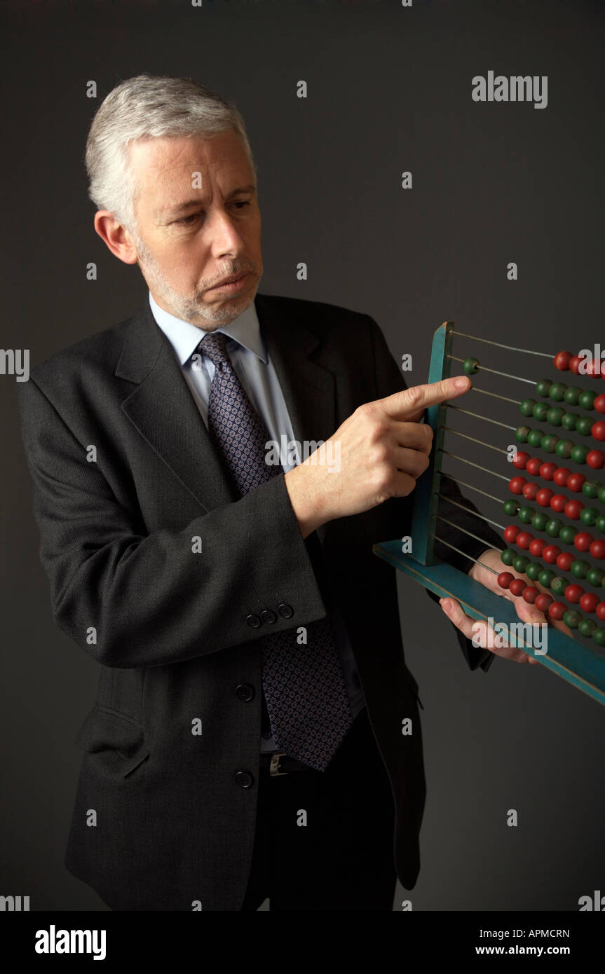 Man holding an Abacus Stock Photo - Alamy