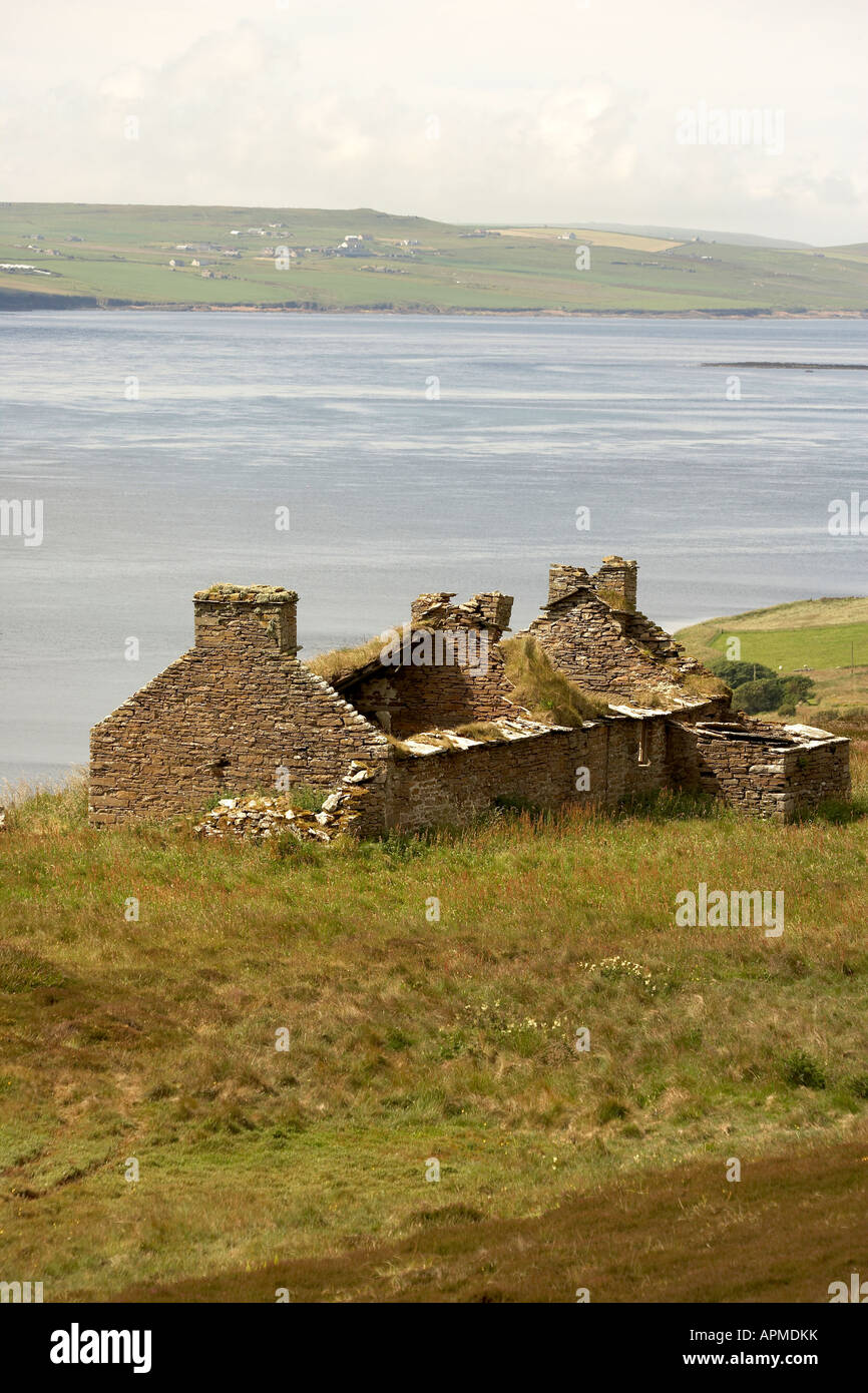 Deserted cottage over looking the Eynhallow Sound Rousay Orkney ...