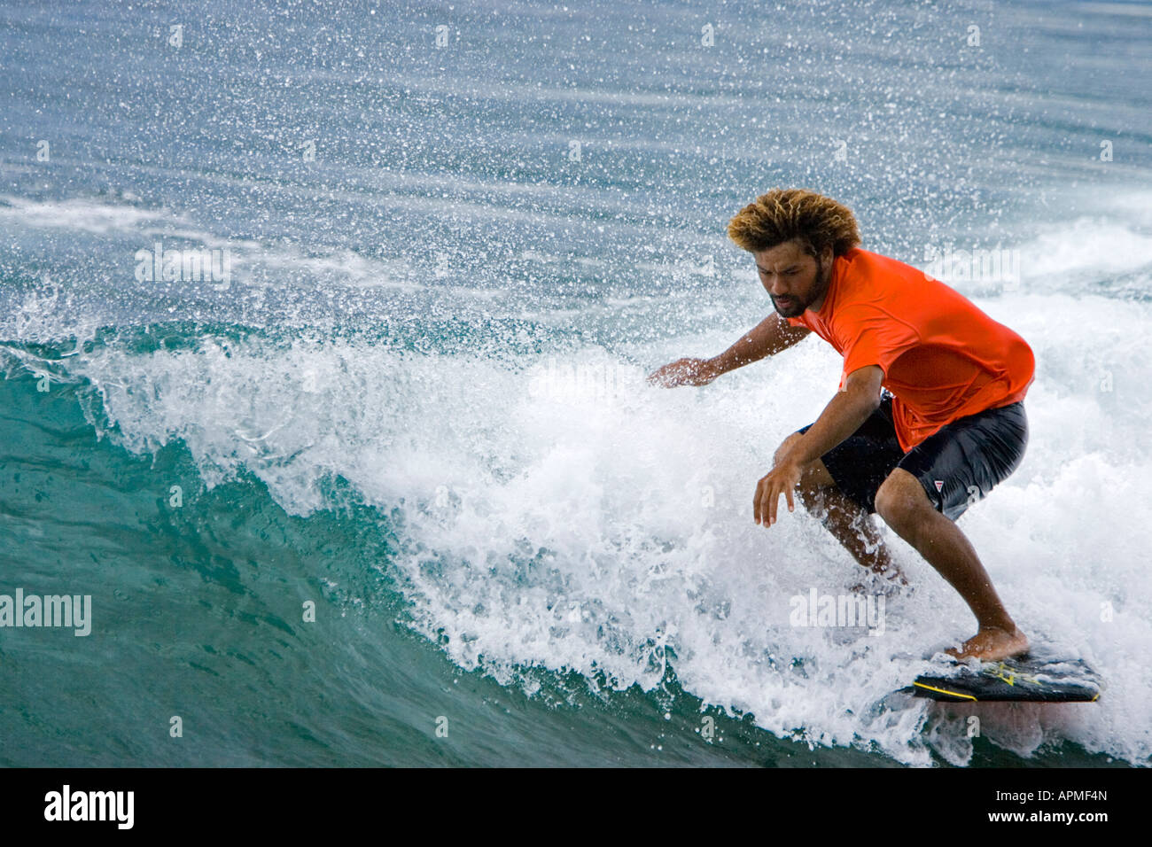 Wave rider in surf Waikiki Beach Honolulu Hawaii USA Stock Photo - Alamy