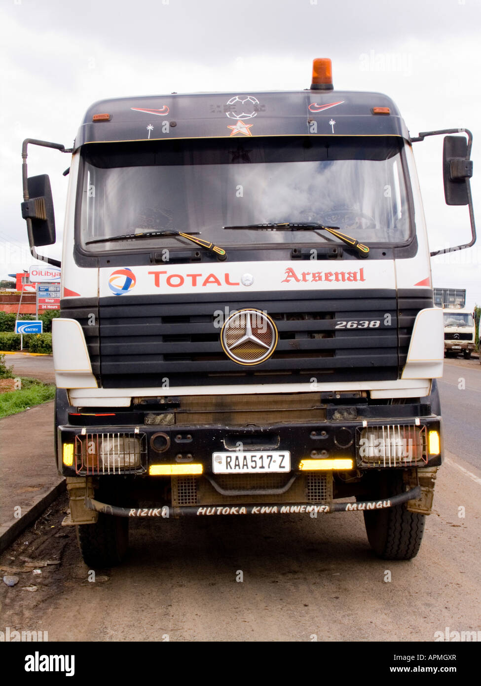 Parked lorry with Total petrol and Arsenal football club signs on main ...
