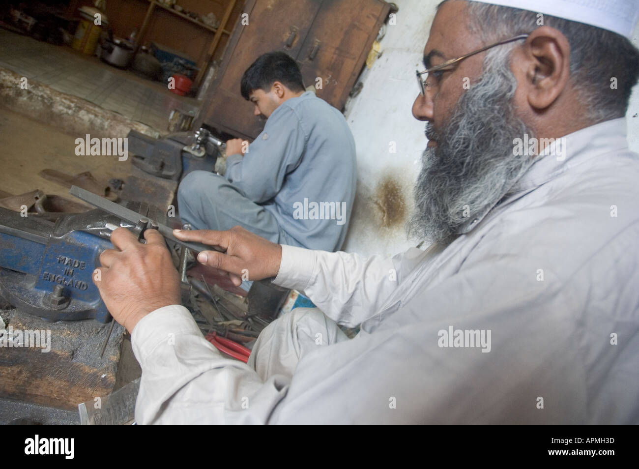 Two gunmakers at work in Darra Adam Khel Pakistan largest arms bazaar ...