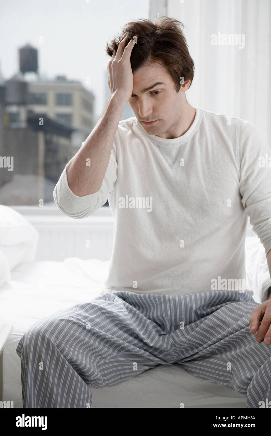 Man sitting up in bed hi-res stock photography and images - Alamy