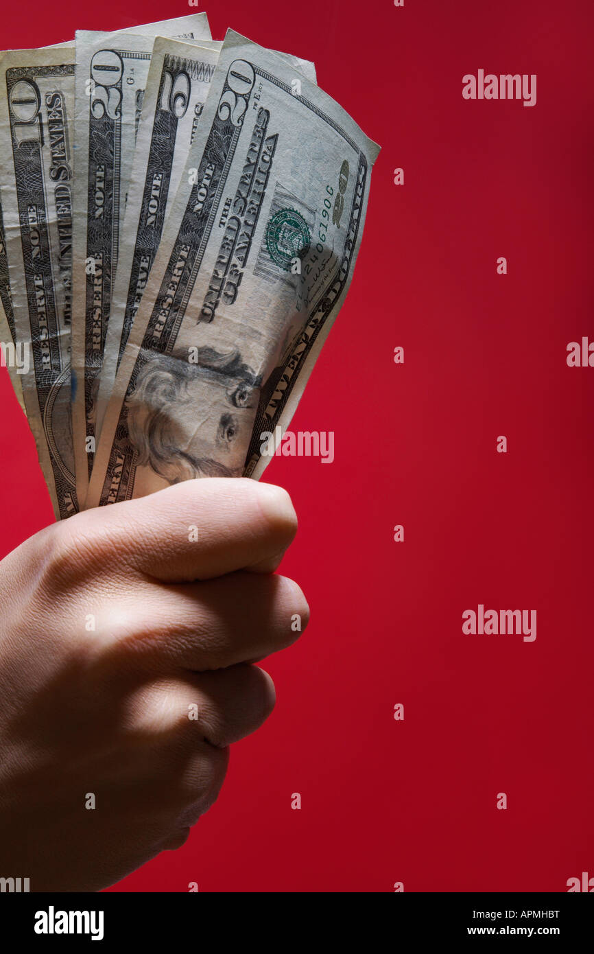 Hand holding five notes hi-res stock photography and images - Alamy