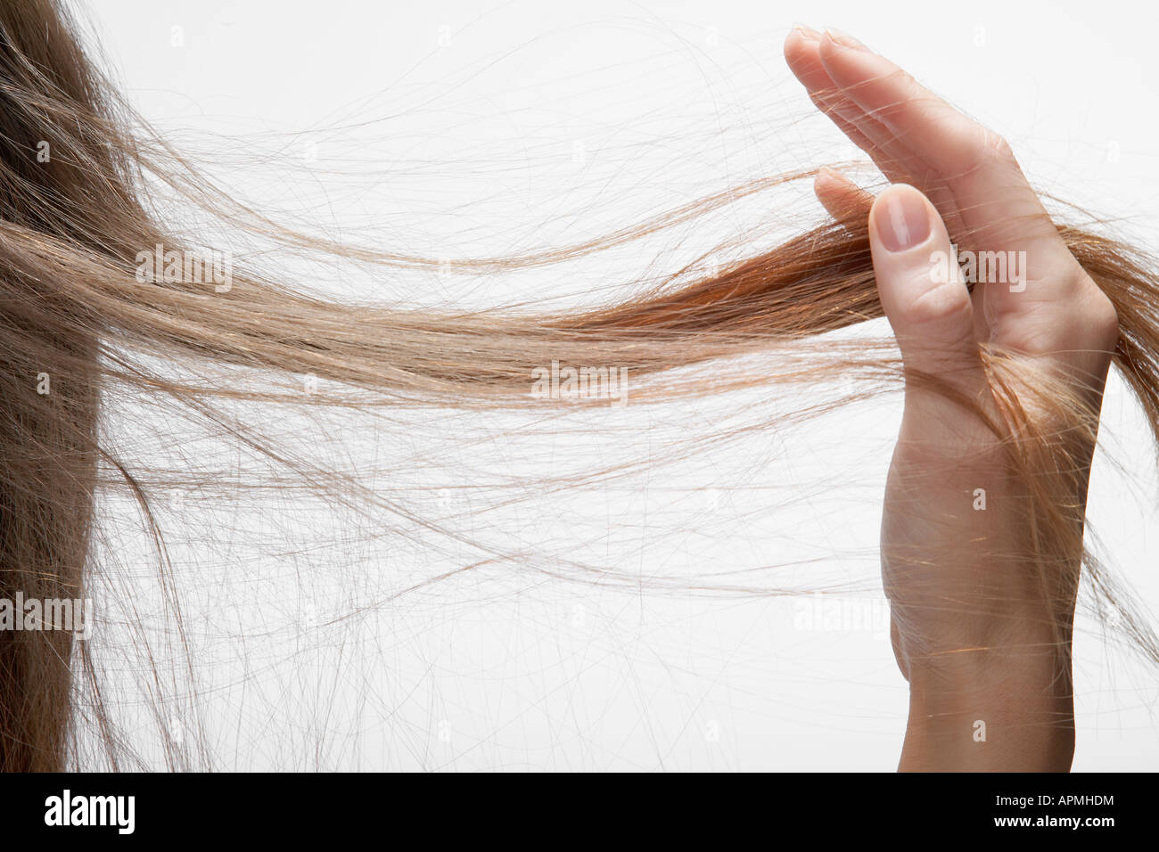 Young woman playing with her hair (close-up Stock Photo - Alamy