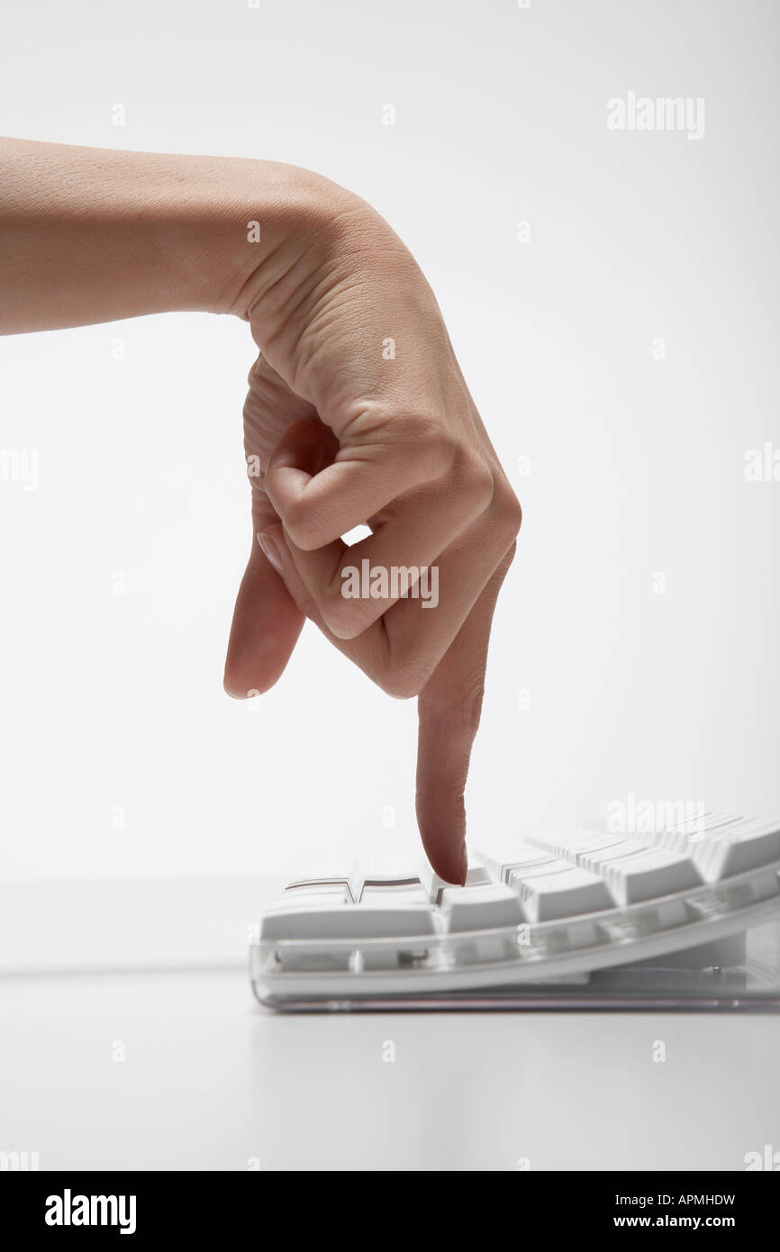 Young woman typing with index finger (close-up Stock Photo - Alamy