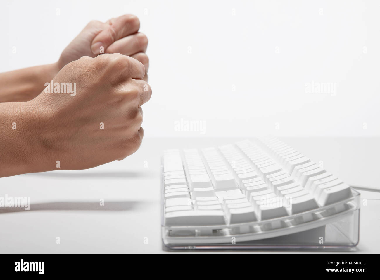 Woman's fists near computer keyboard (close-up Stock Photo - Alamy