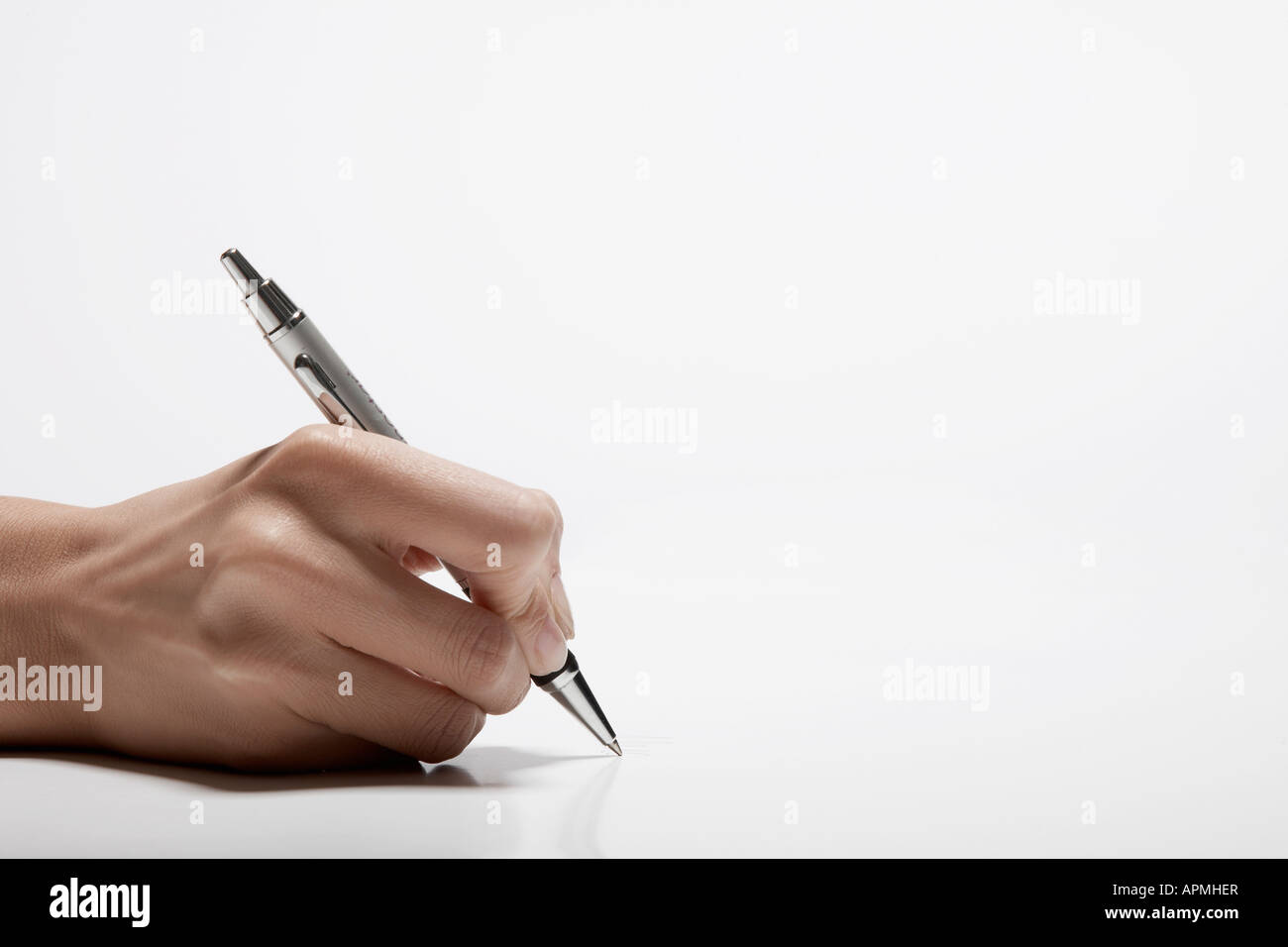 Woman's hand holding pen (close-up Stock Photo - Alamy