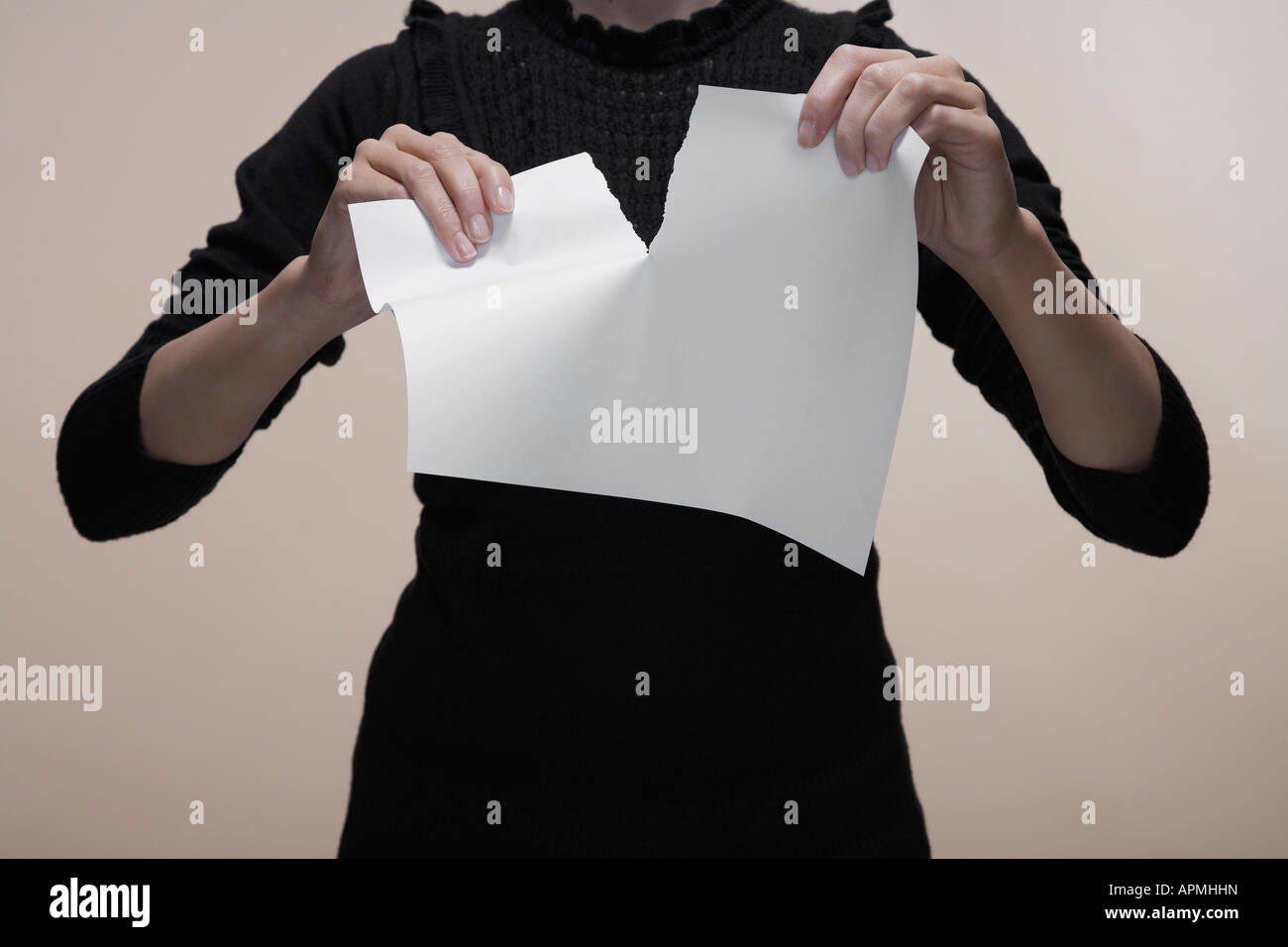 Woman tearing up paper hi-res stock photography and images - Alamy