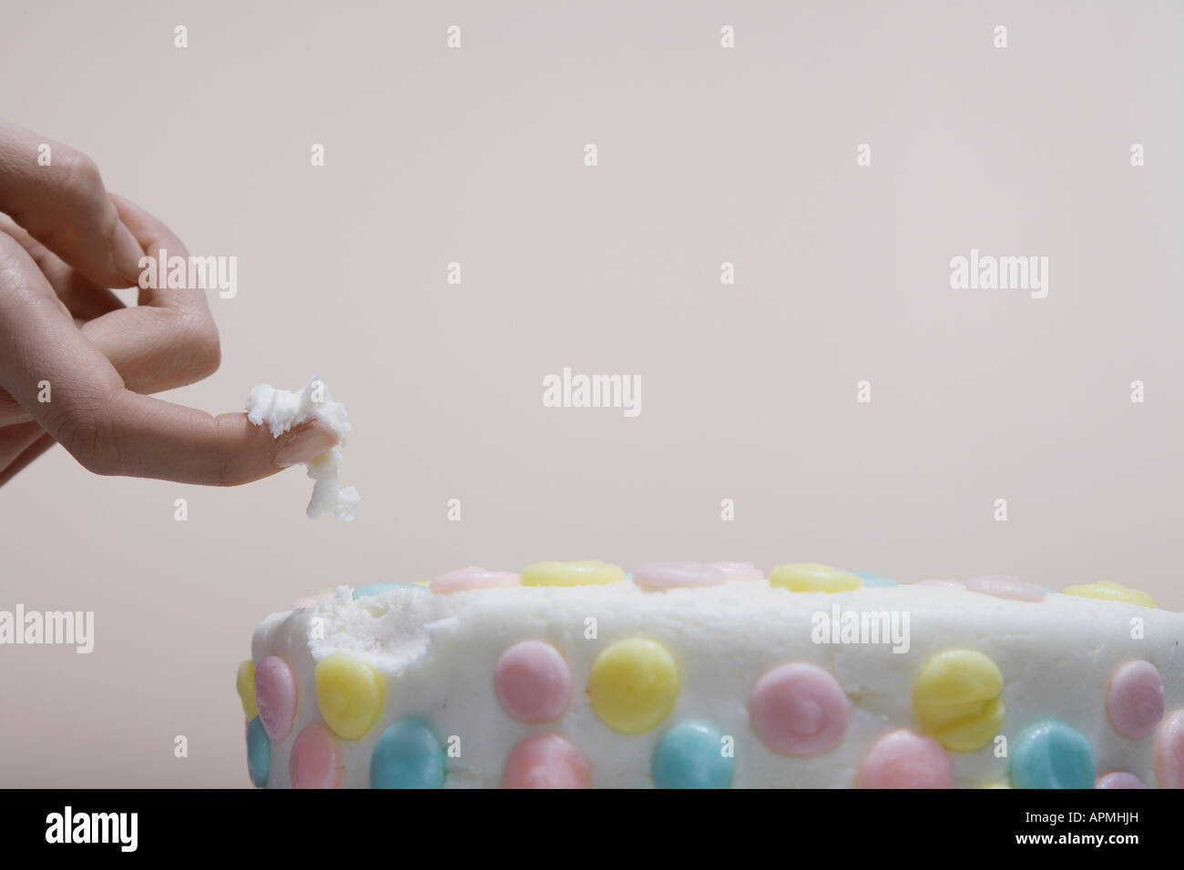 Woman's finger in cake (close-up Stock Photo - Alamy