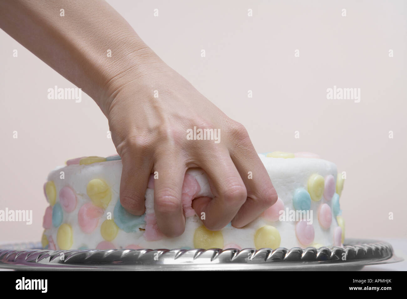 Woman's hands on cake (close-up Stock Photo - Alamy