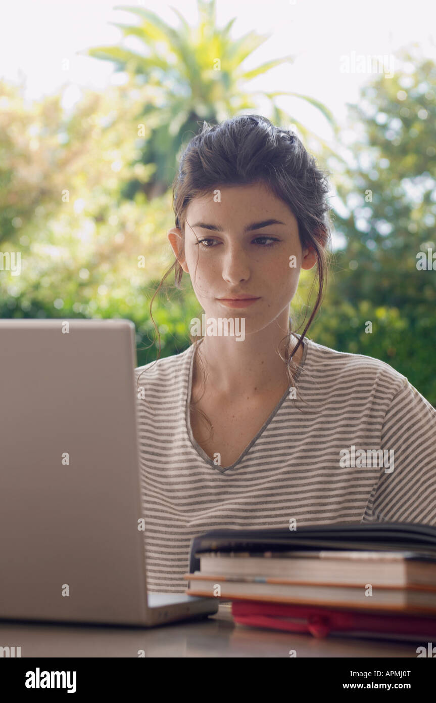 Young woman studying and using laptop Stock Photo - Alamy