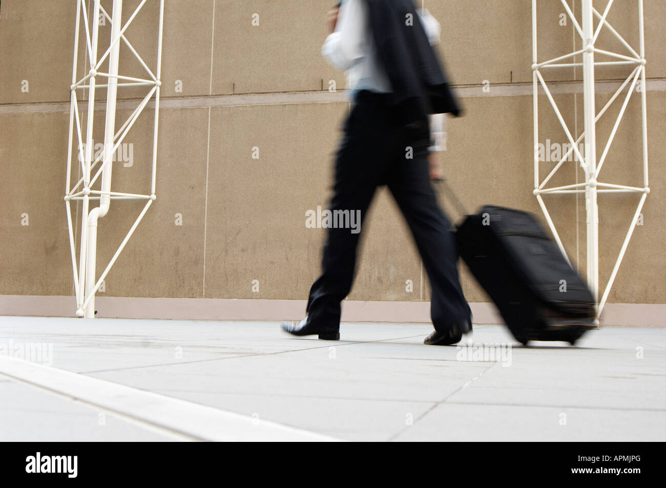 Businessman pulling briefcase (low section Stock Photo - Alamy