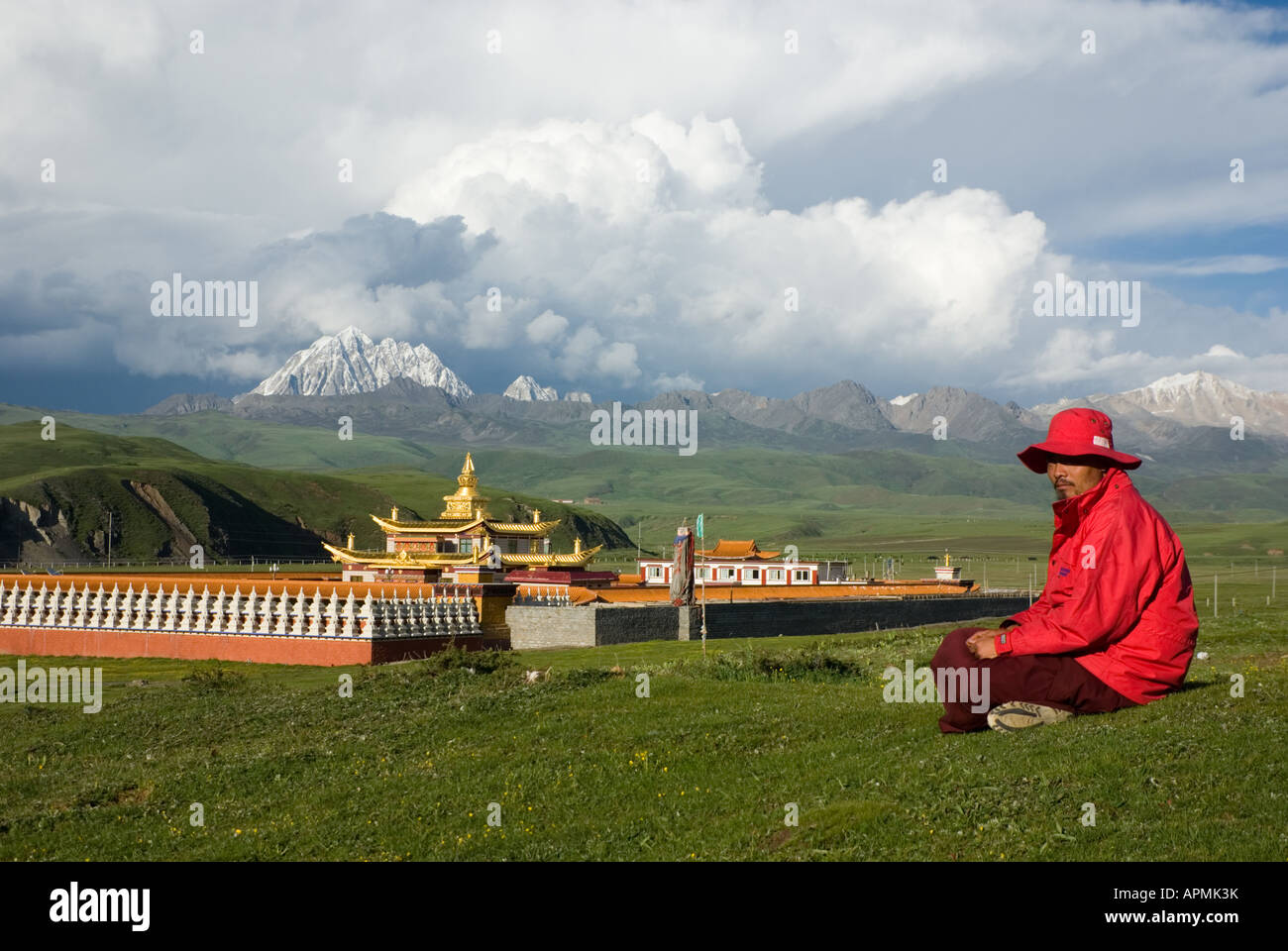 tibetan monk overlooking mountain valley in front of monastery Stock ...