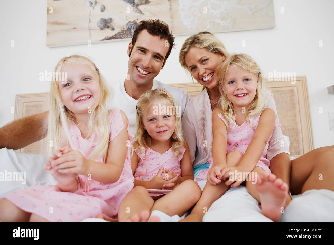 Mid adult couple with triplets (portrait Stock Photo - Alamy