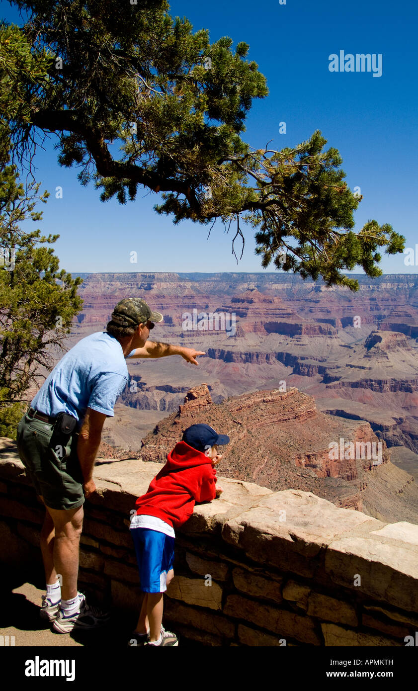 Father showing young son the wonders of the South Rim of the famous ...