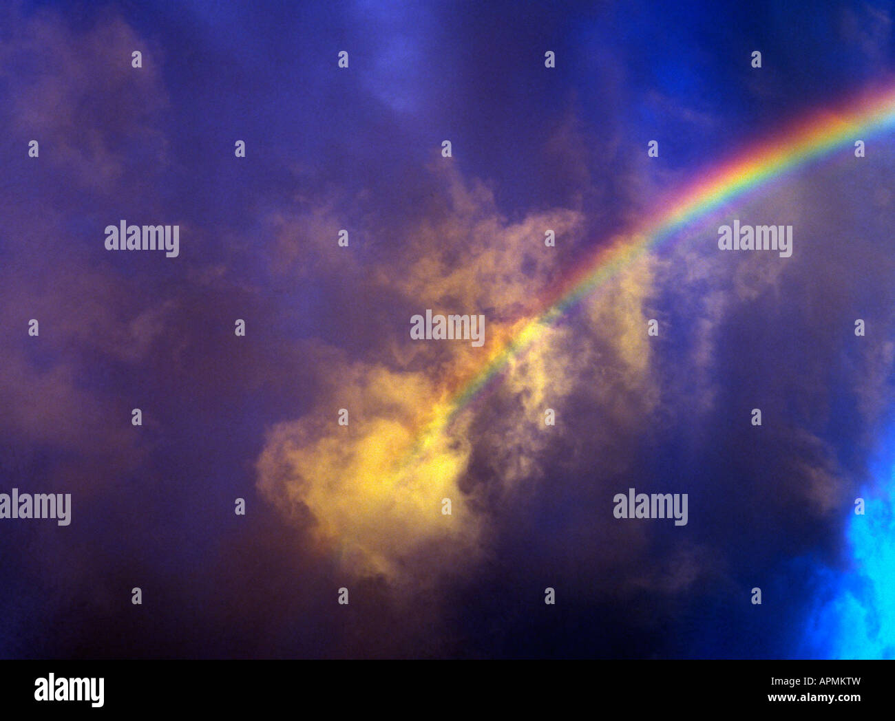 dramatic sky with a stark rainbow in the sky Stock Photo - Alamy