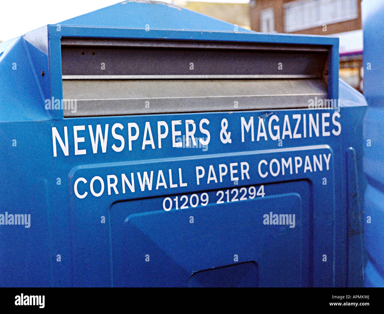 a blue recycling newspaper and magazine station Stock Photo - Alamy