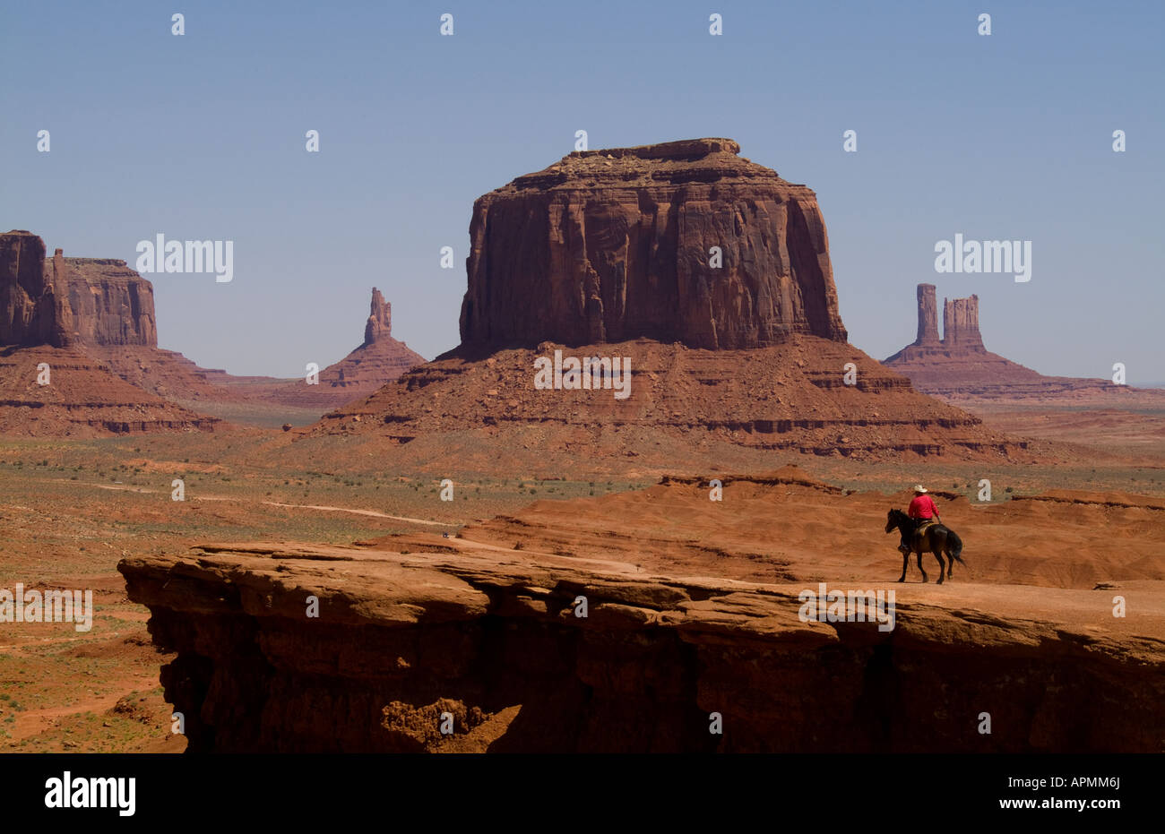 Monument Valley Utah with mittens and great Cherokee Indian on horse as ...