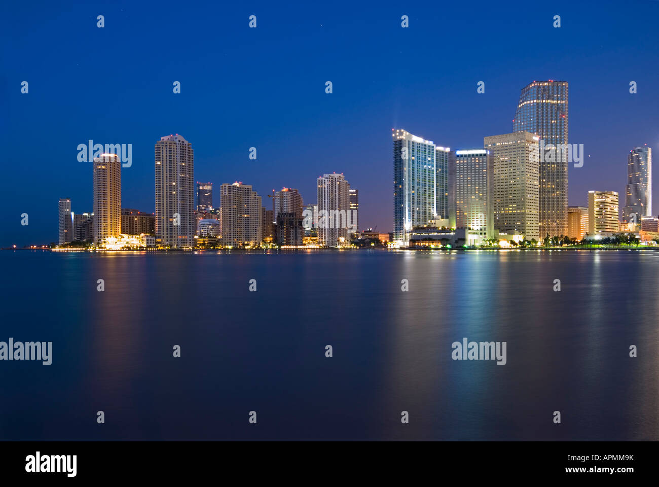 Just before a blue dawn Biscayne Bay reflects high rise buildings Miami ...